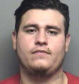 Man arrested after allegedly driving Camaro in reverse across town