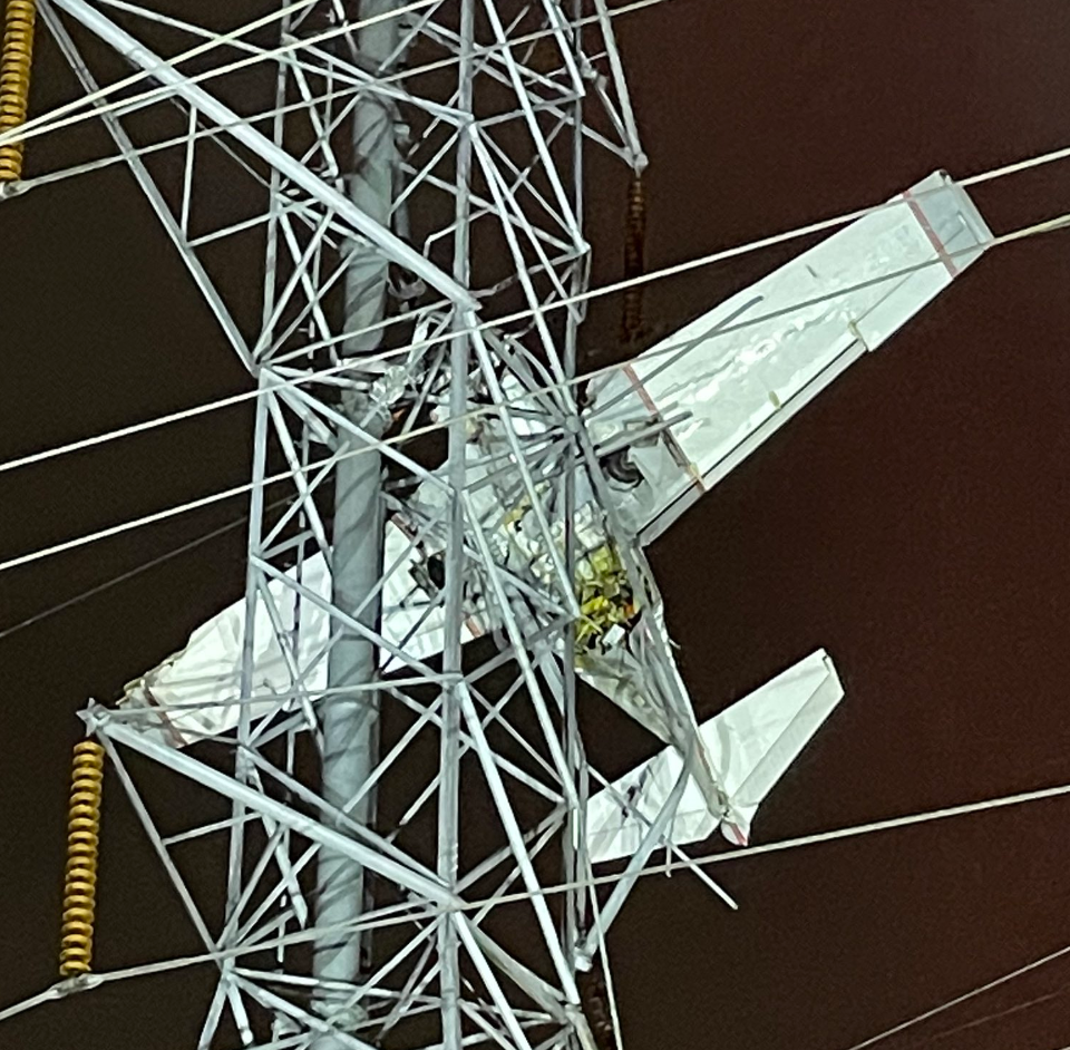 After 6 hours, 2 rescued from plane caught in power lines