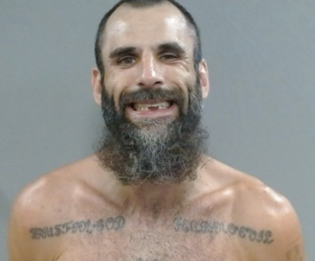 Suspect drove over Kansas officer's leg ahead of crash